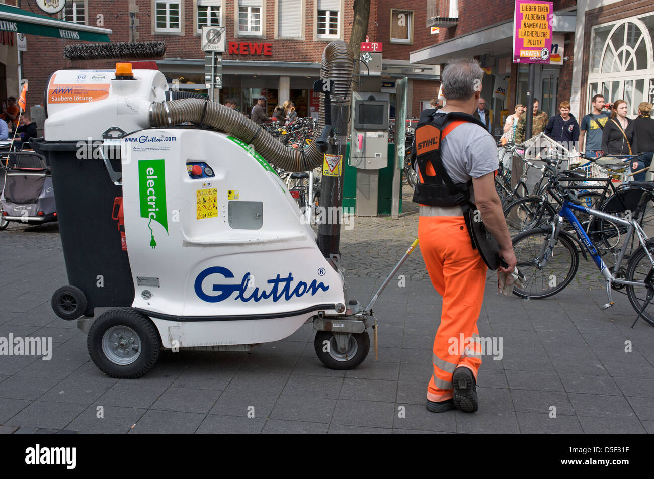 Glutton street cleaning machine and operator Stock Photo - Alamy