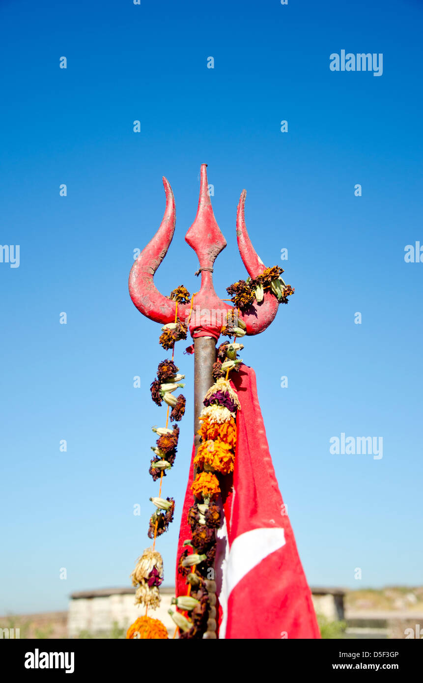 hindu god Shiva sacred trident and red flags In India Stock Photo - Alamy