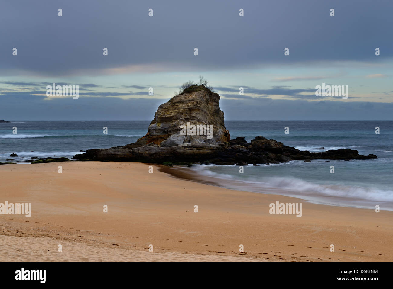 Lonely rock on the beach Stock Photo - Alamy