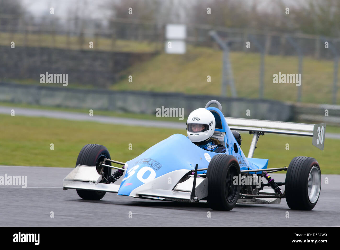A car racing around Castle Combe Circuit at the Bristol Motor Club's ...