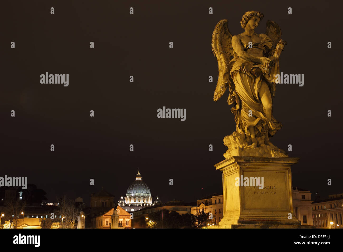 Angel statue over the Vatican City at night Stock Photo - Alamy