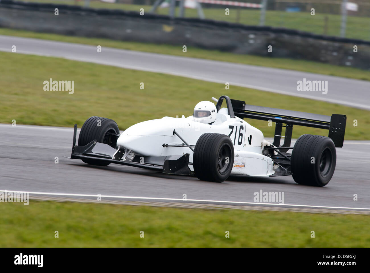 A car racing around Castle Combe Circuit at the Bristol Motor Club's ...