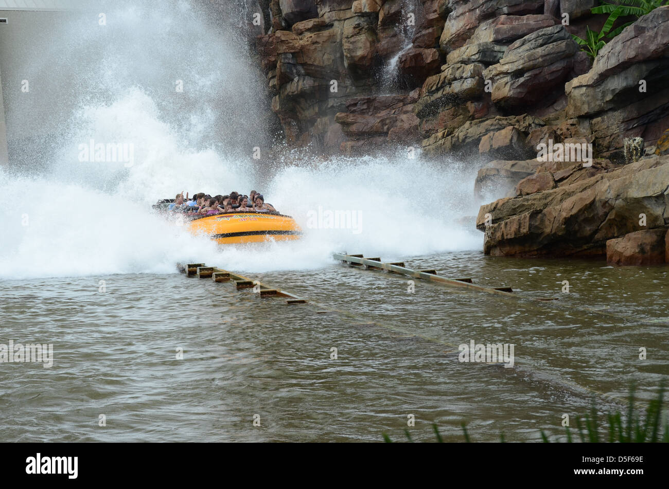 People getting wet on the Jurassic Park, the Ride at Universal Studio's ...
