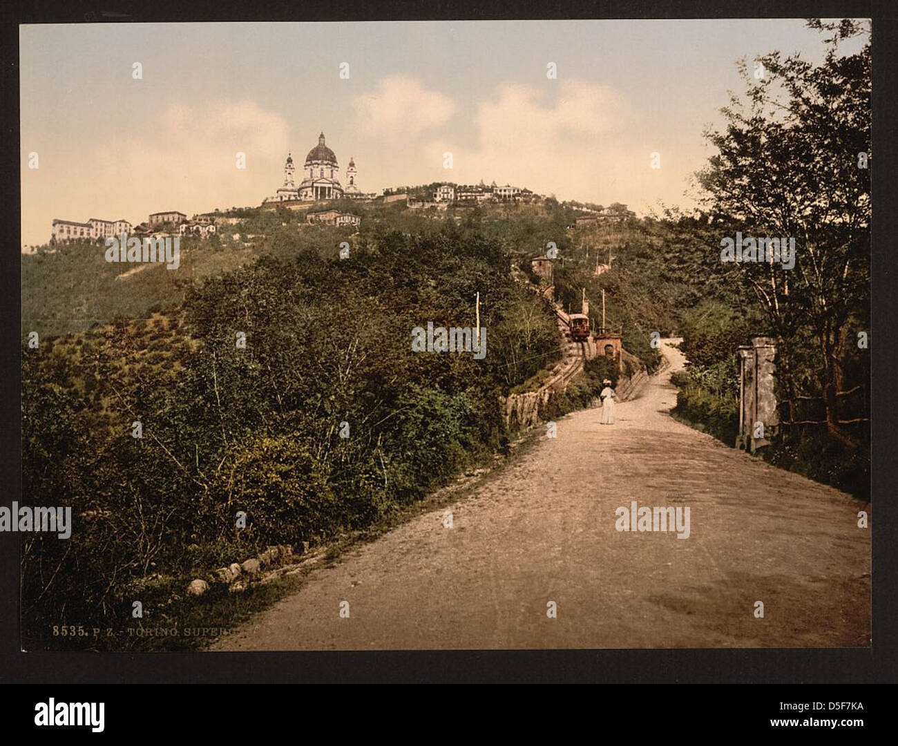 A photograph capturing a road and railway in Turin, Italy. The image ...