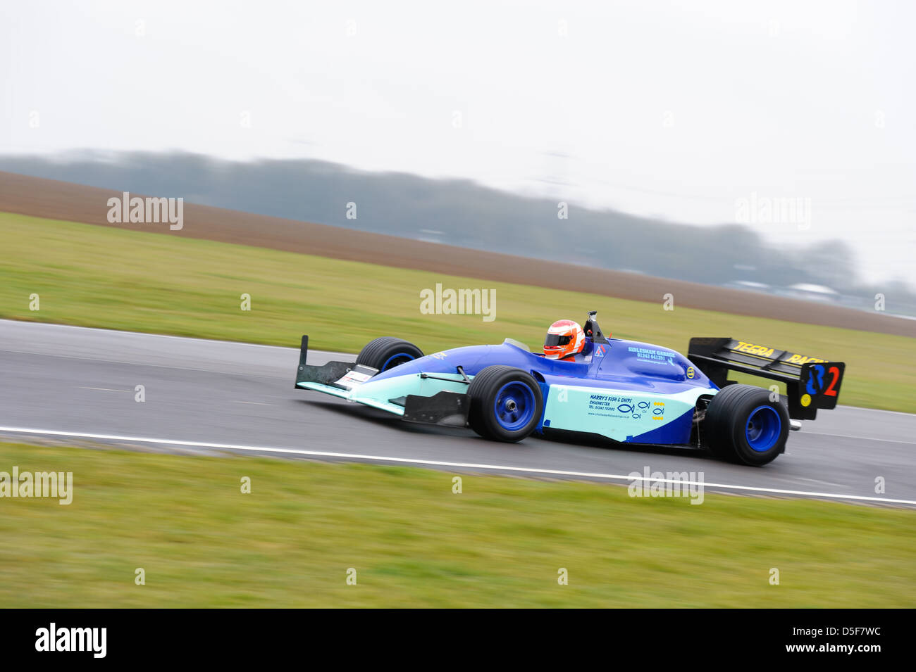 A car racing around Castle Combe Circuit at the Bristol Motor Club's ...