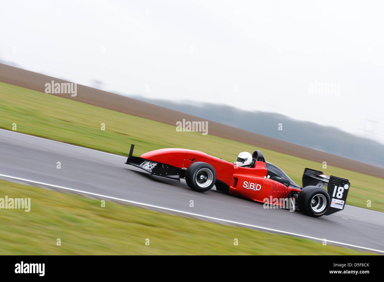 A car racing around Castle Combe Circuit at the Bristol Motor Club's ...