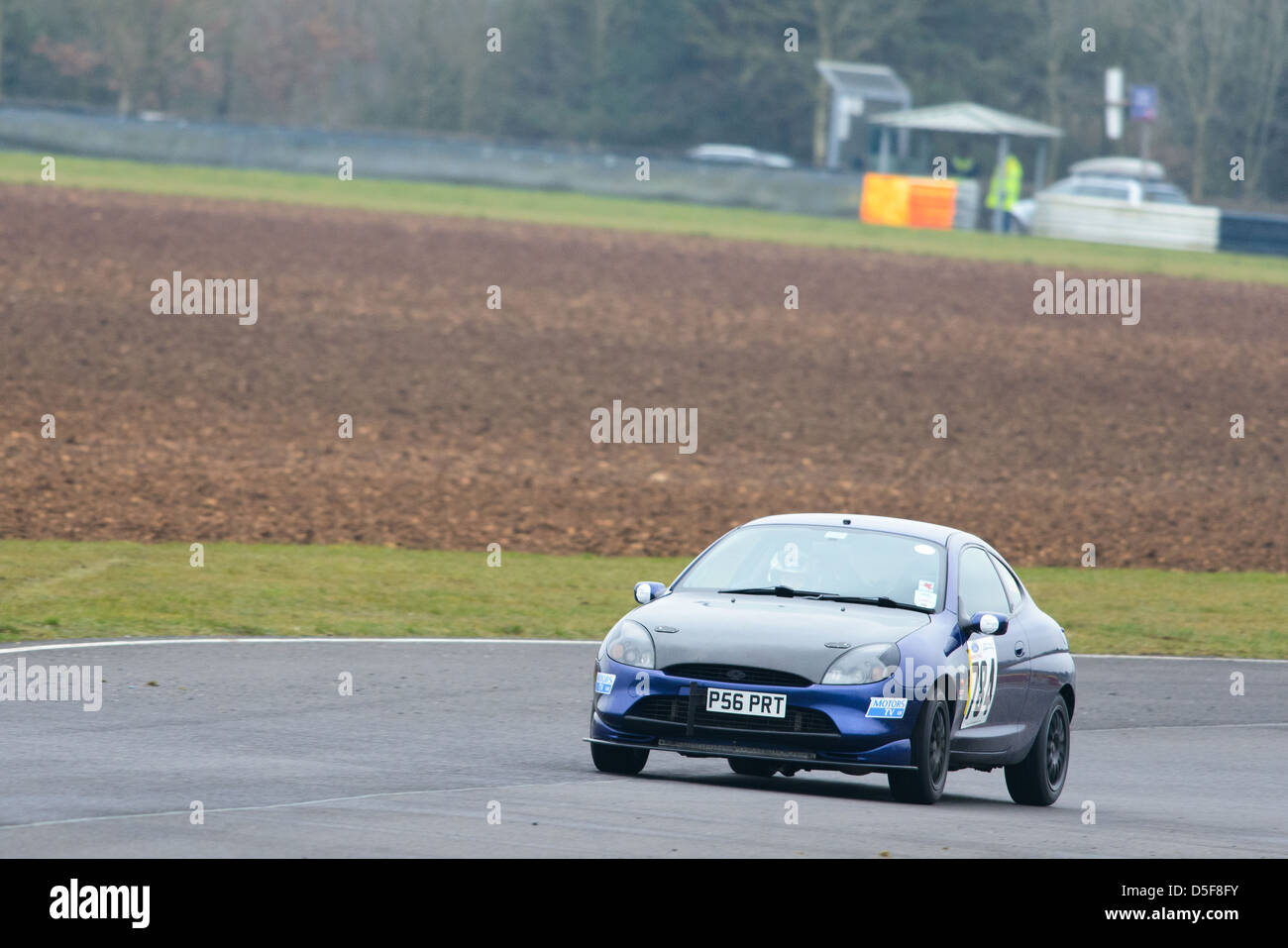 A car racing around Castle Combe Circuit at the Bristol Motor Club's ...