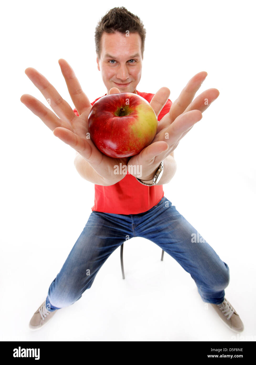 handsome man in red shirt with apple concept of health care & healthy ...