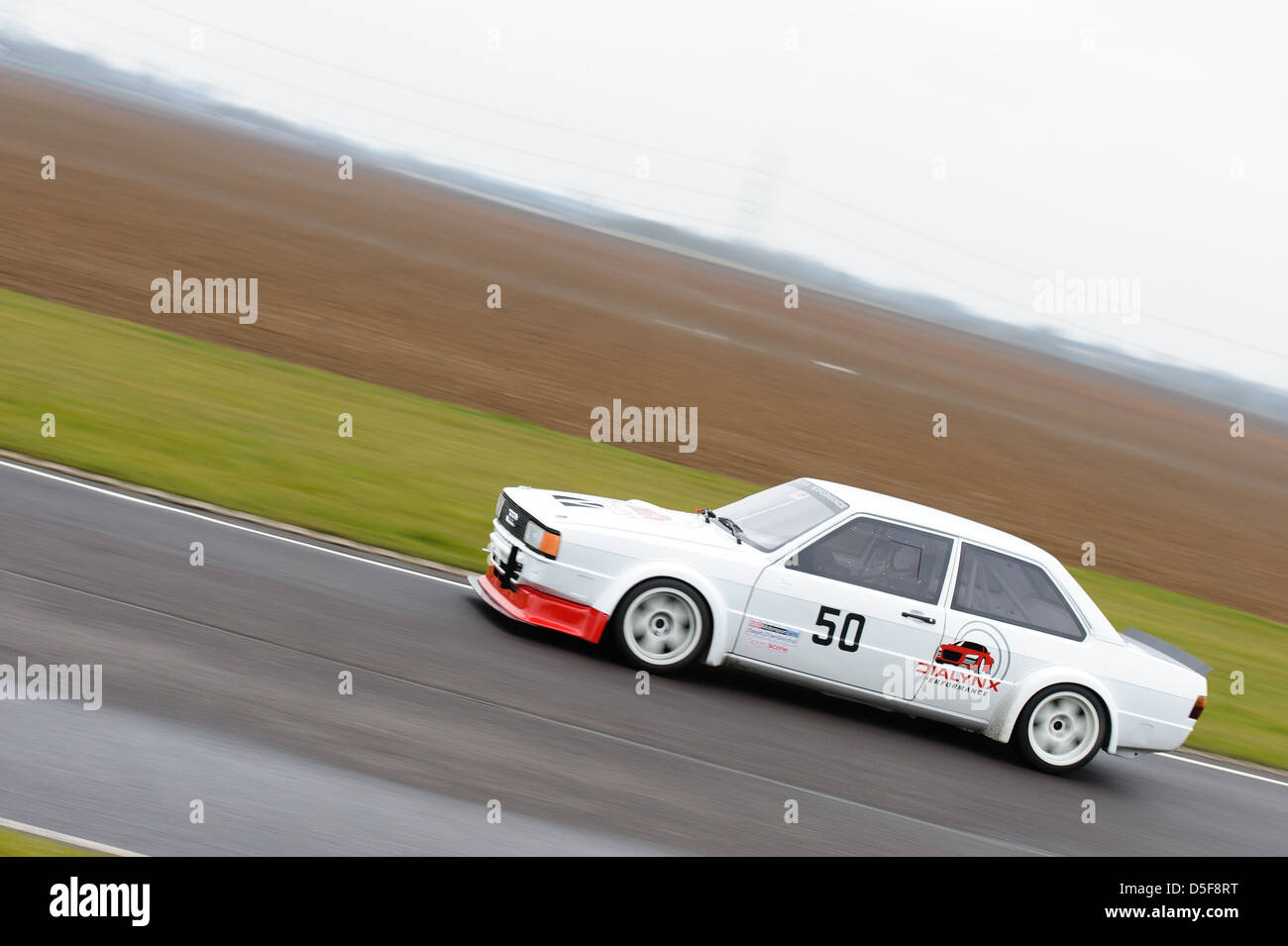 A car racing around Castle Combe Circuit at the Bristol Motor Club's ...