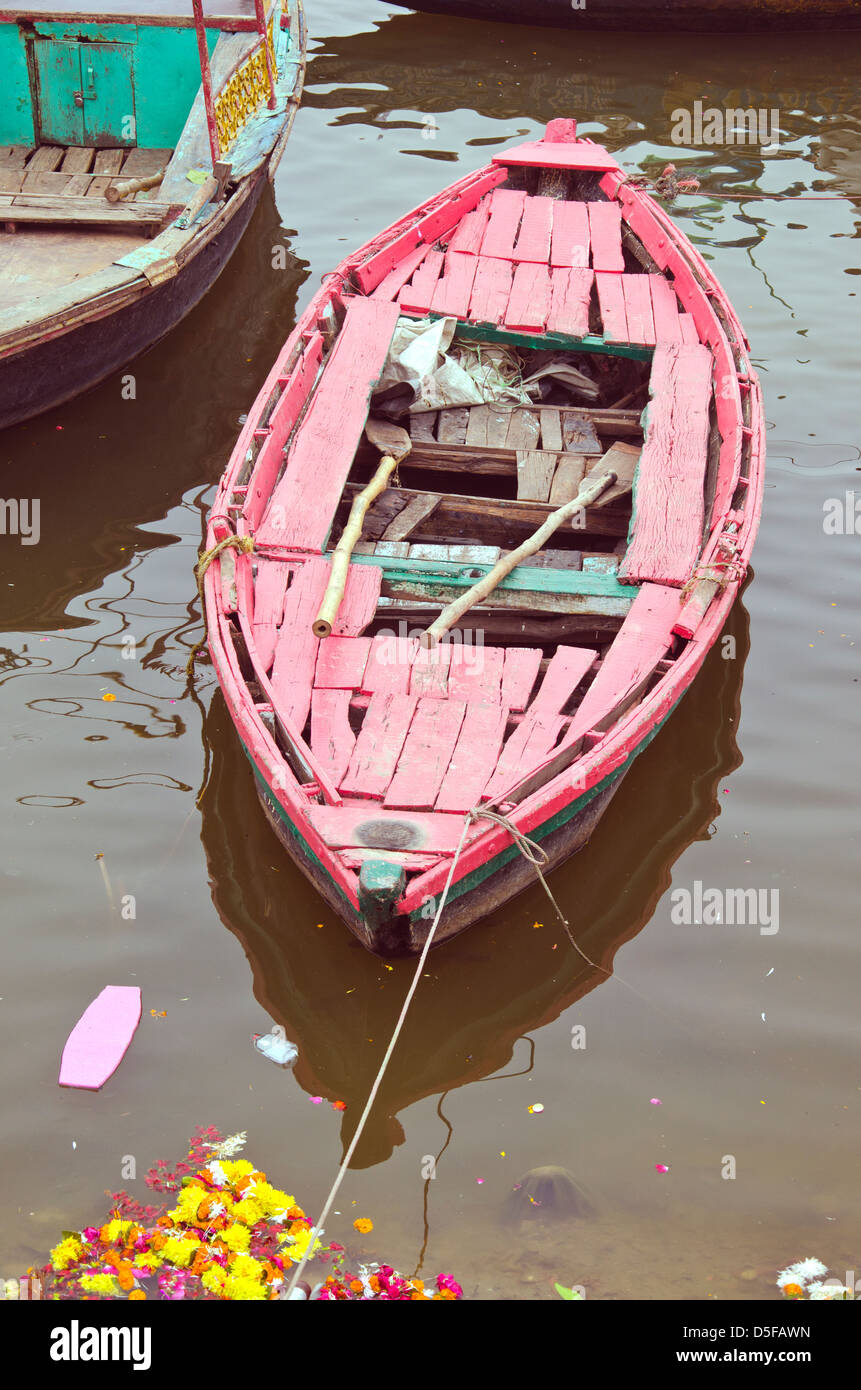 old and aged red boat in sacred Ganges river, Varanasi, India Stock ...