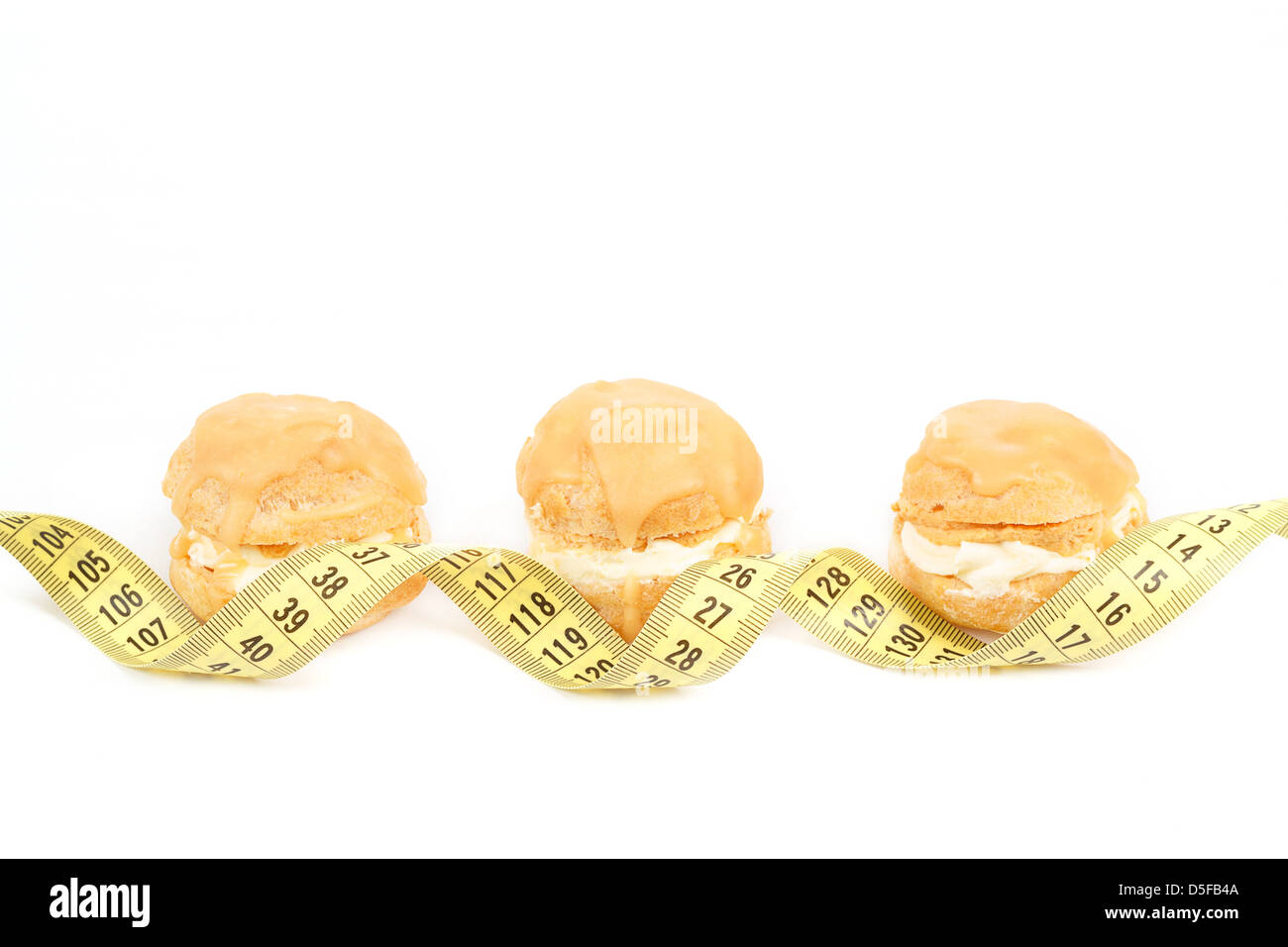 Cake concept diet tape measure Cut Out Stock Images & Pictures - Alamy