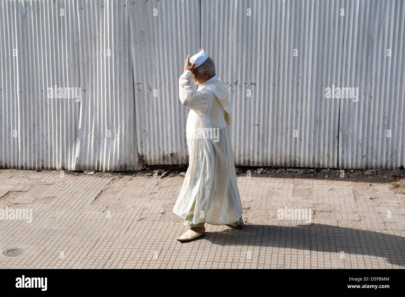 Man walking on a street in Meknes, Morocco Stock Photo - Alamy