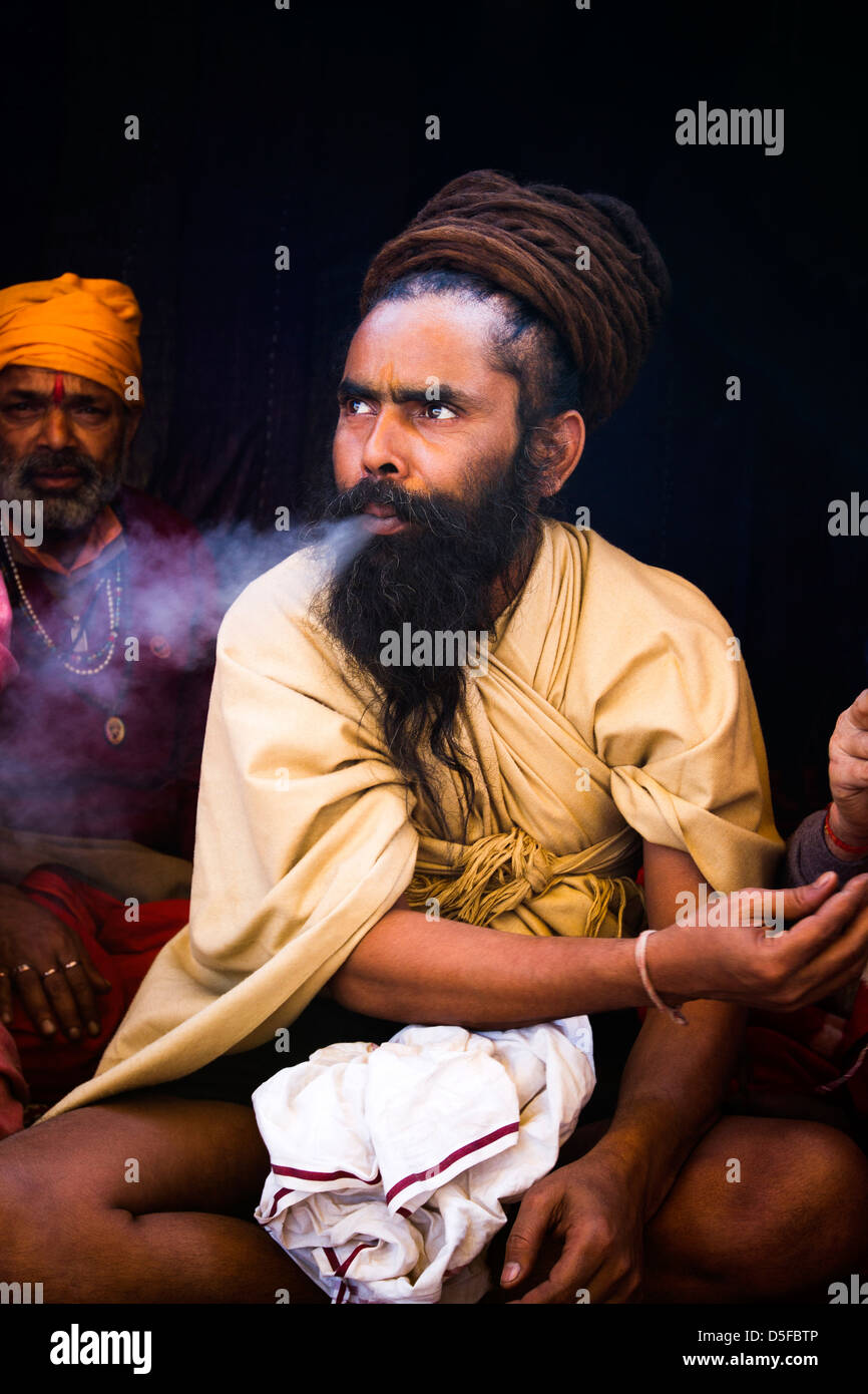 Sadhu smoking chilam in kumbha hi-res stock photography and images - Alamy