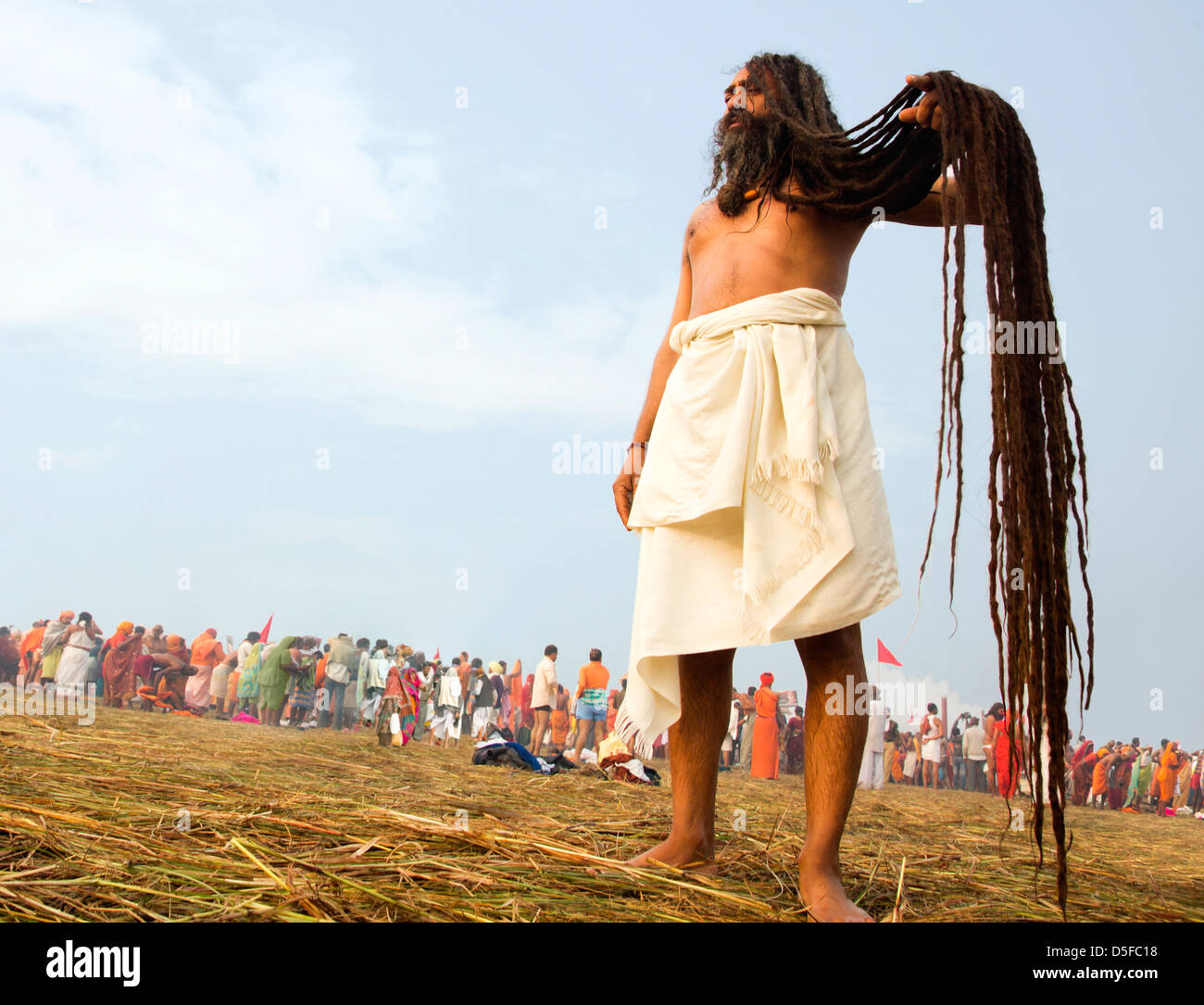 Sadhu holding his dreadlocks during the first royal bath procession in ...