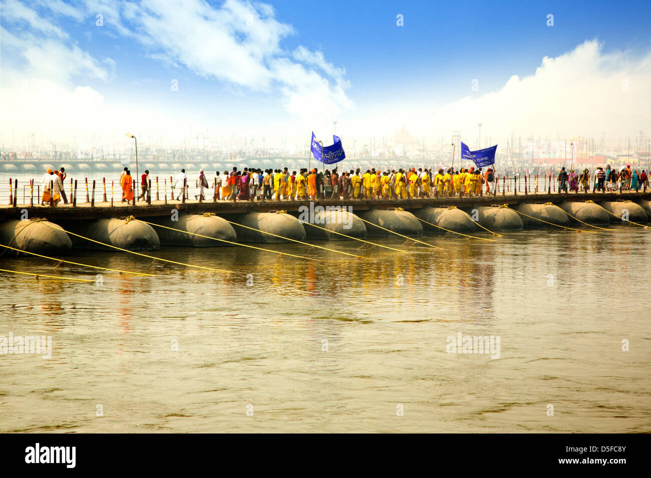 Pilgrims crossing the bridge during the first royal bath procession in ...