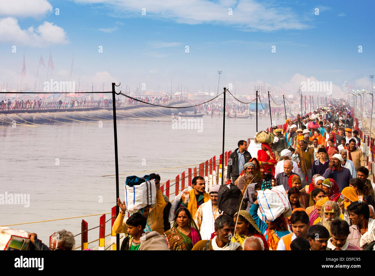 Pilgrims crossing the bridge during the first royal bath procession in ...