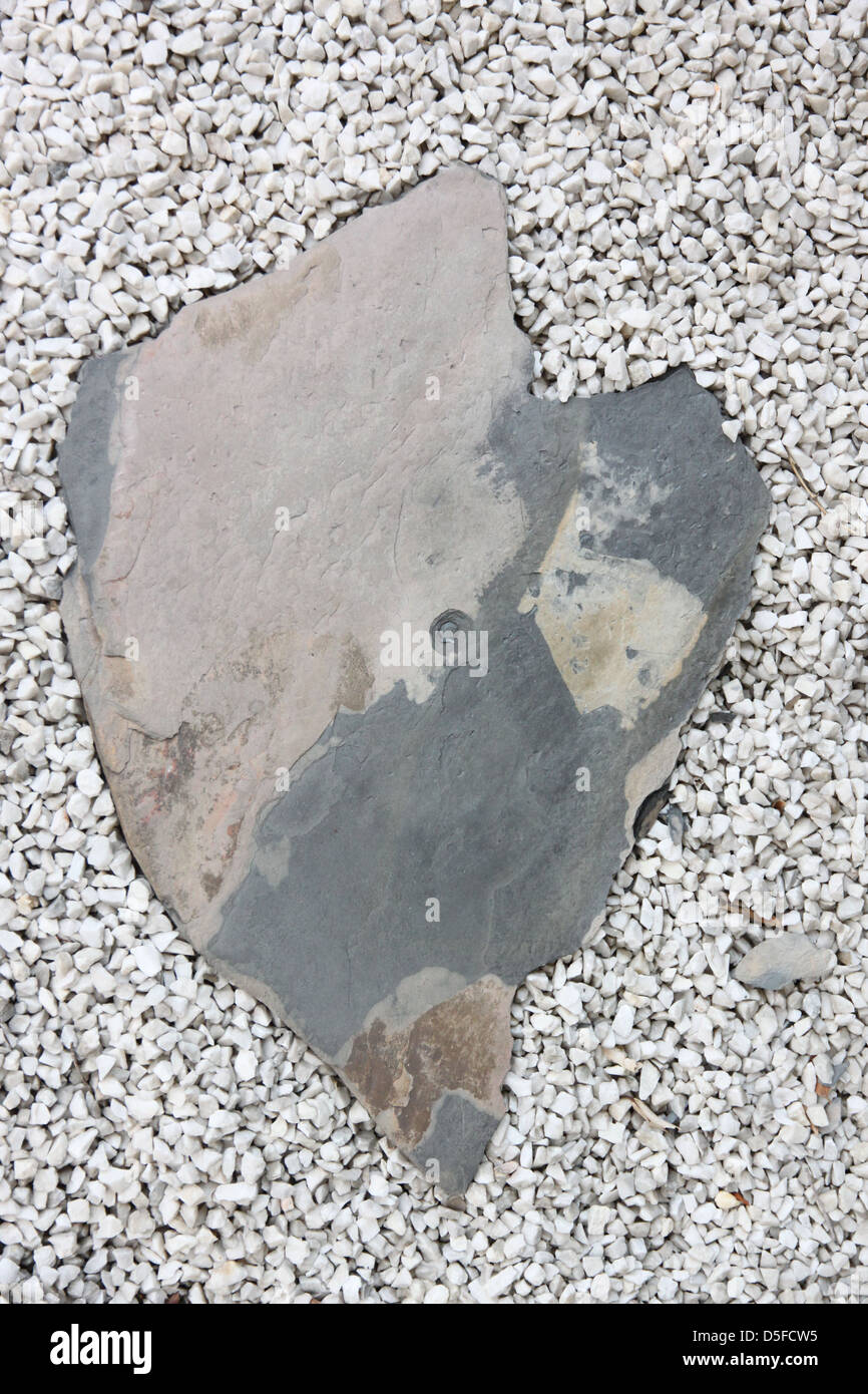 The Large stone slabs on a white small rock Stock Photo - Alamy