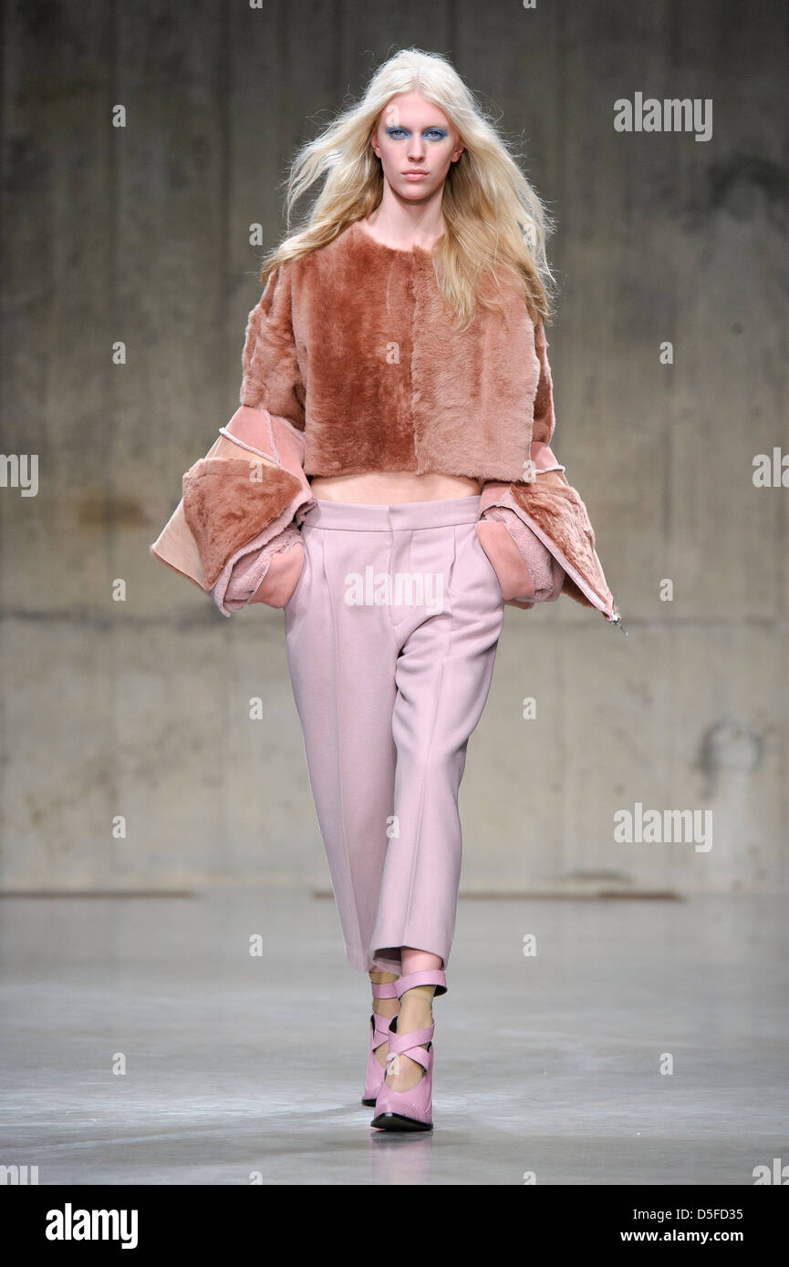 A model wears a design from the Unique collection during London Fashion ...