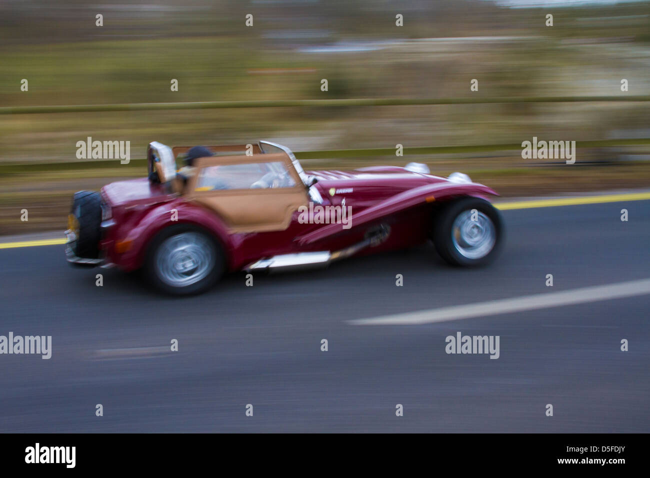 A motion blurred image of Westfield two-seater, open top sports car ...