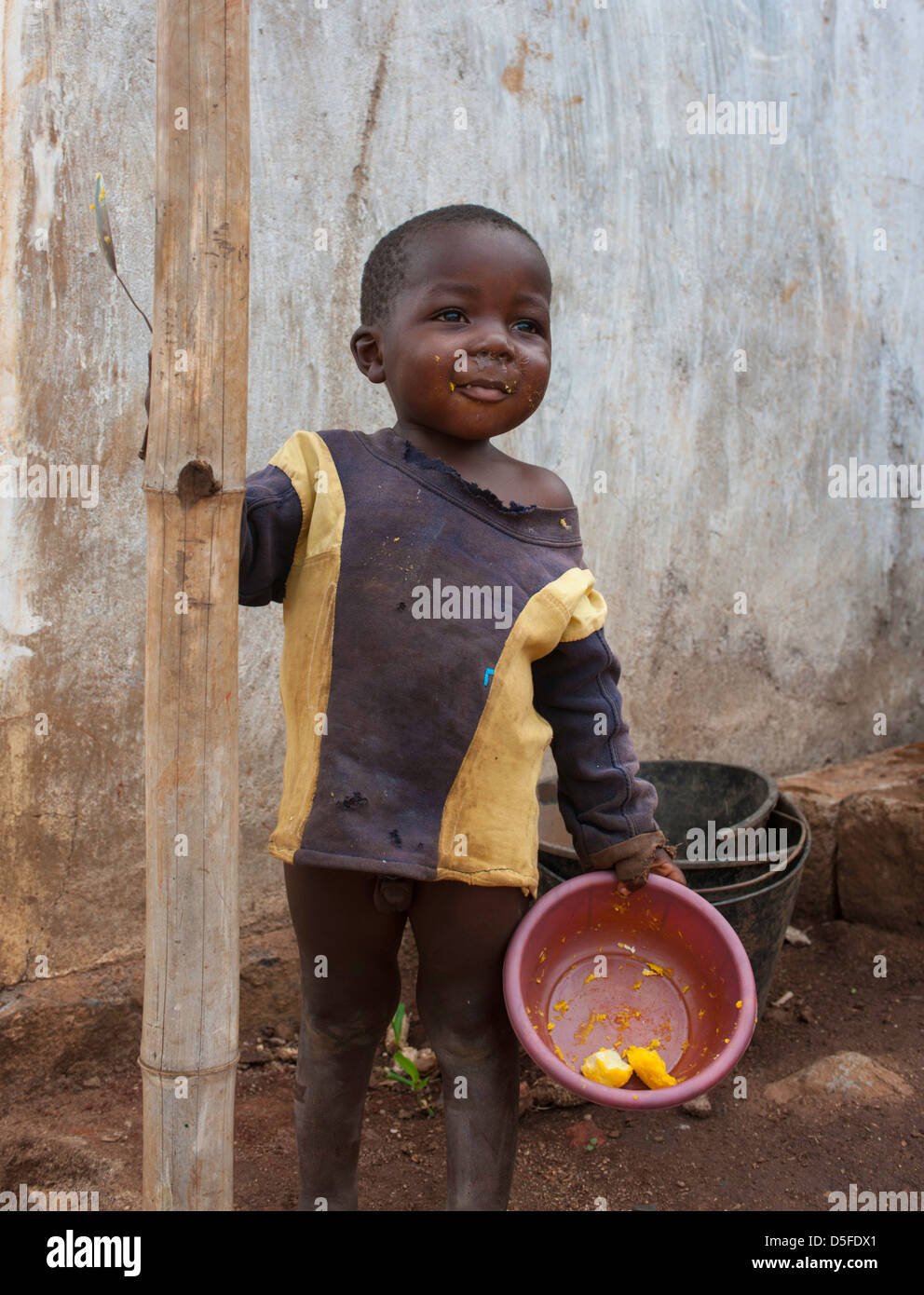 African child eating in Cameroon with bowl and spoon Stock Photo - Alamy