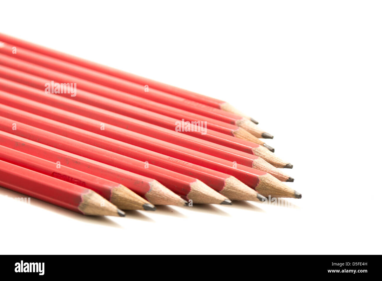Row of normal red colored lead pencils shaped into an arrow Stock Photo ...