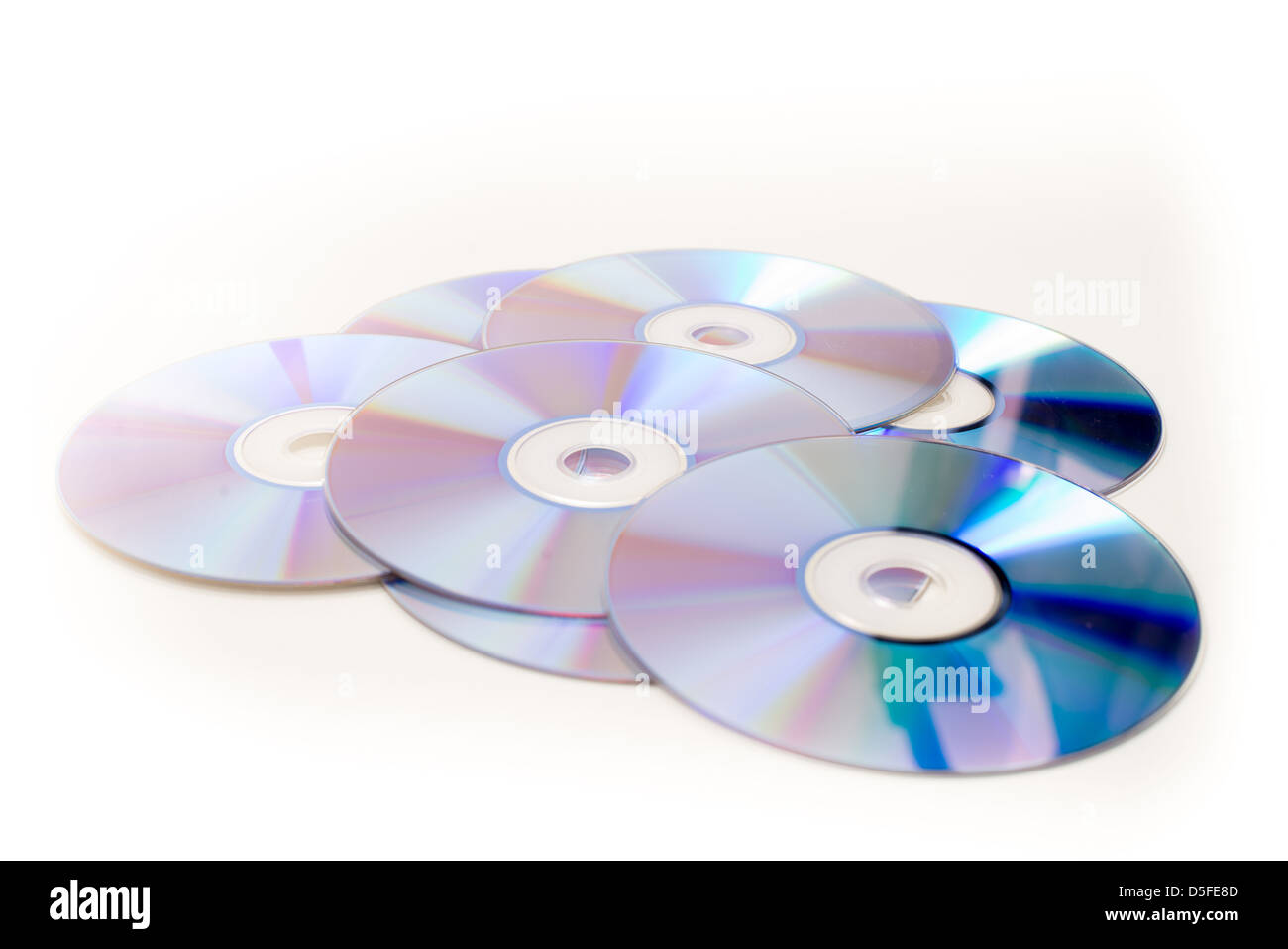 Large pile of blue CDs and DVD isolated against a white background ...
