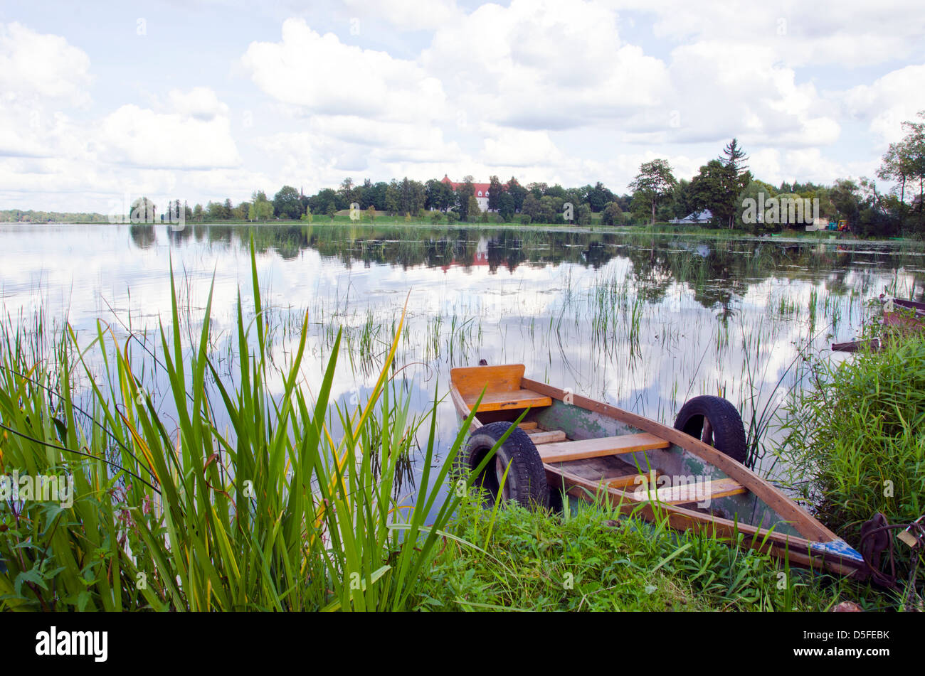 beautiful summer lake and one boat Stock Photo - Alamy