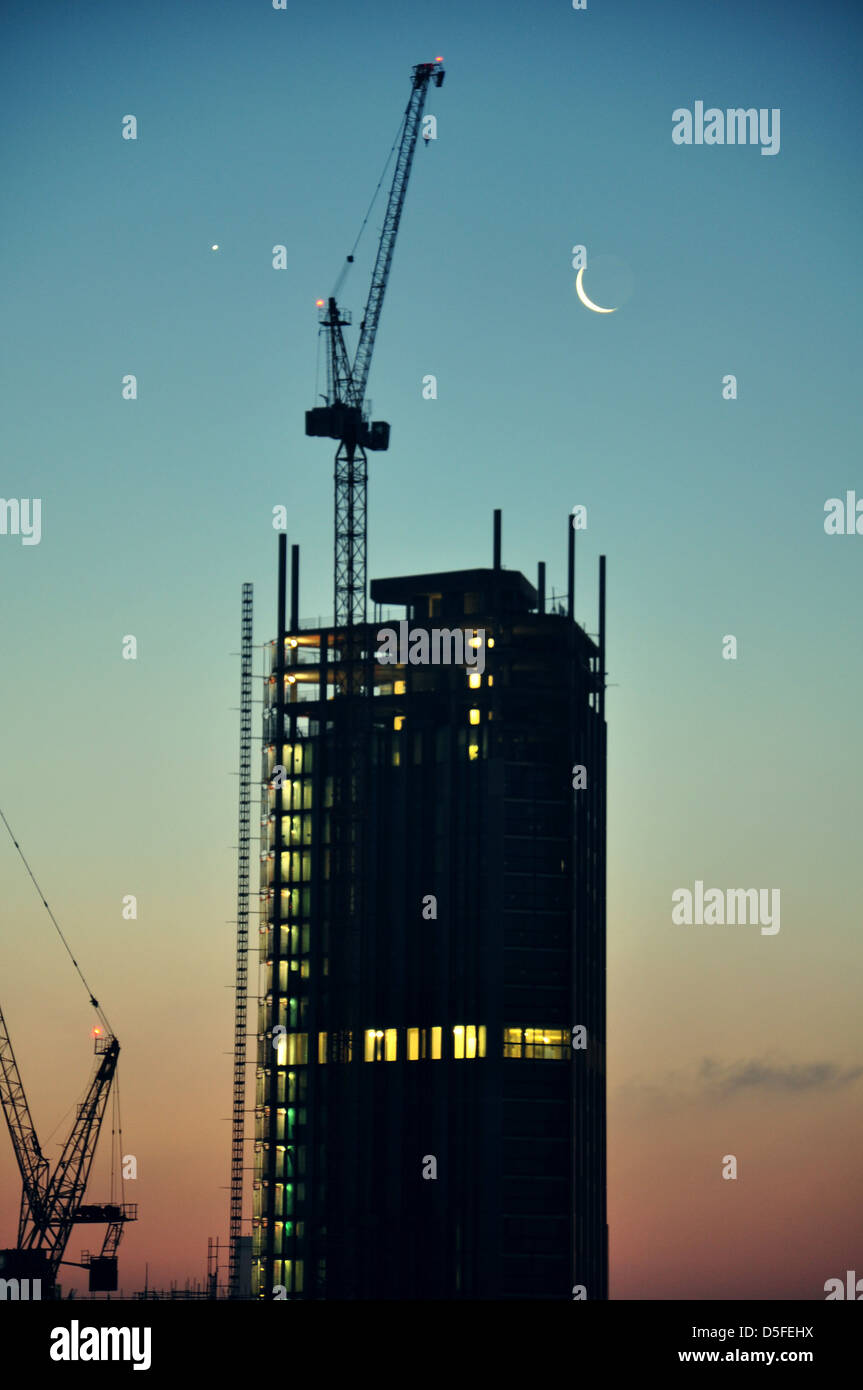 Office block construction at dusk Stock Photo - Alamy