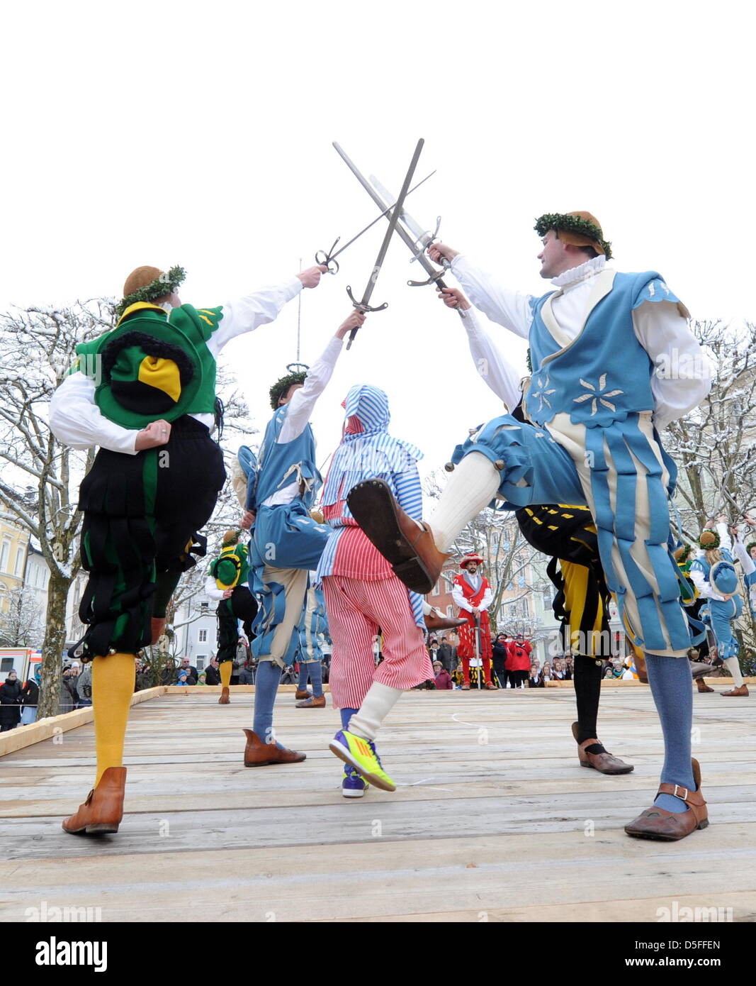 Men wearing German traditional costumes perform a 'Sword Dance' prior ...