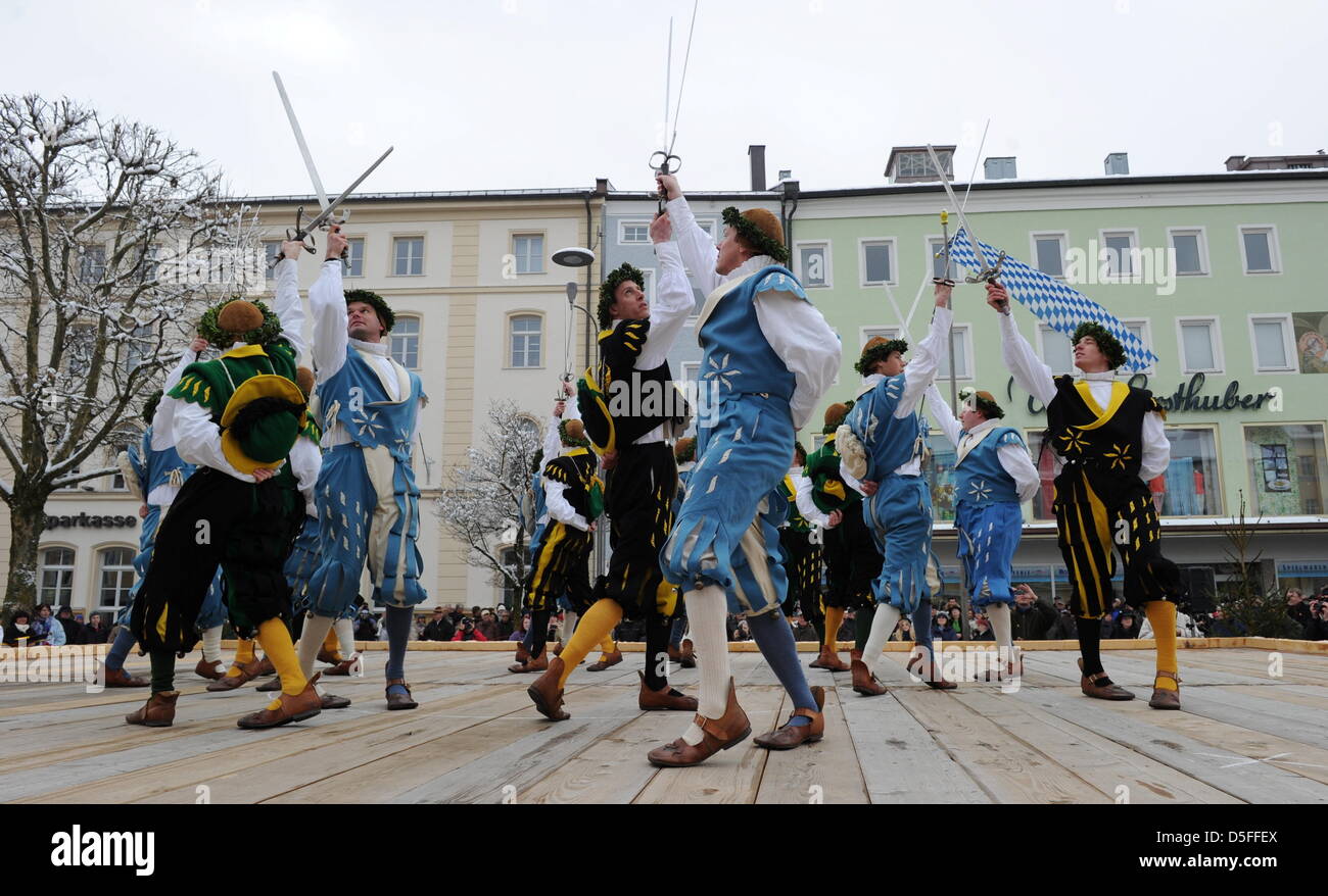 Men wearing German traditional costumes perform a 'Sword Dance' prior ...