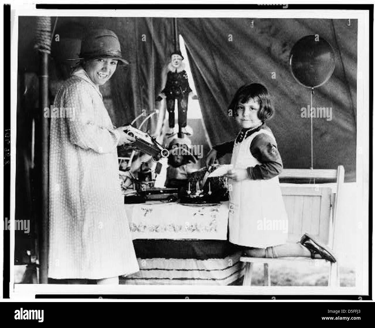 A photograph depicting the behind-the-scenes activities at a circus ...