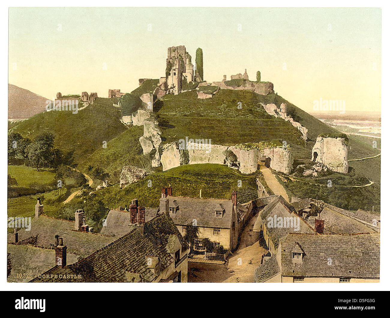 This image depicts the historic Corfe Castle in Dorset, England, a ...