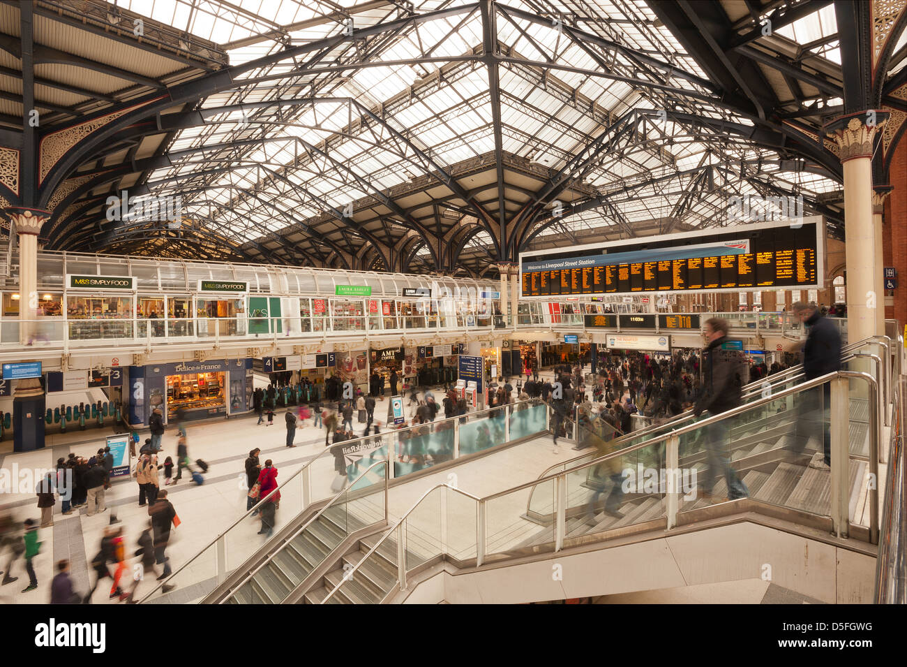 Commuters at Liverpool street station during morning rush hour over a ...