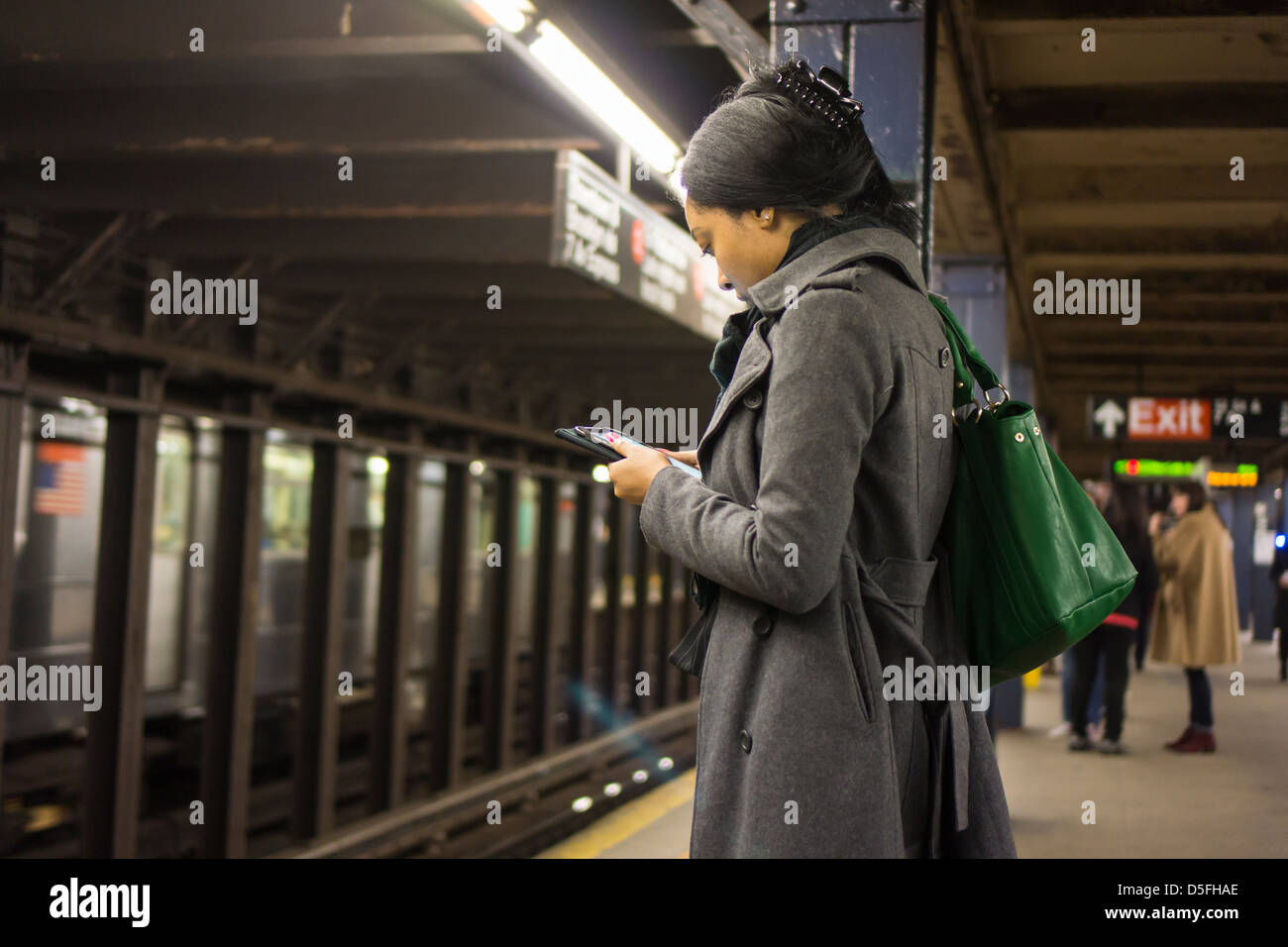 Reading a tablet on the tube hi-res stock photography and images - Alamy