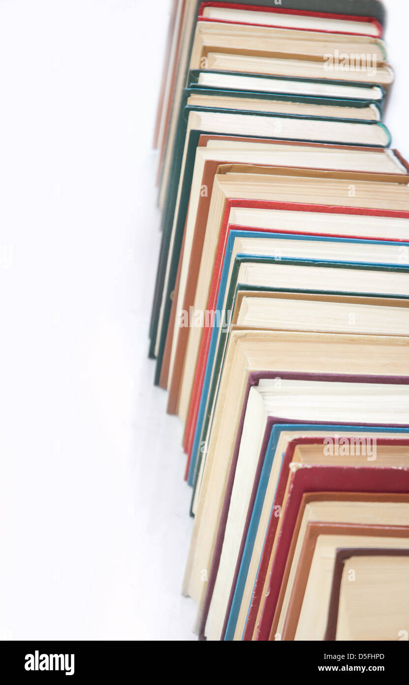 Book heap isolated on white Stock Photo - Alamy