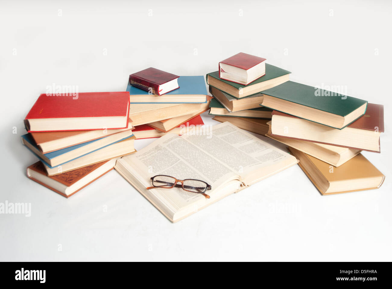 Books and glasses on white Stock Photo - Alamy