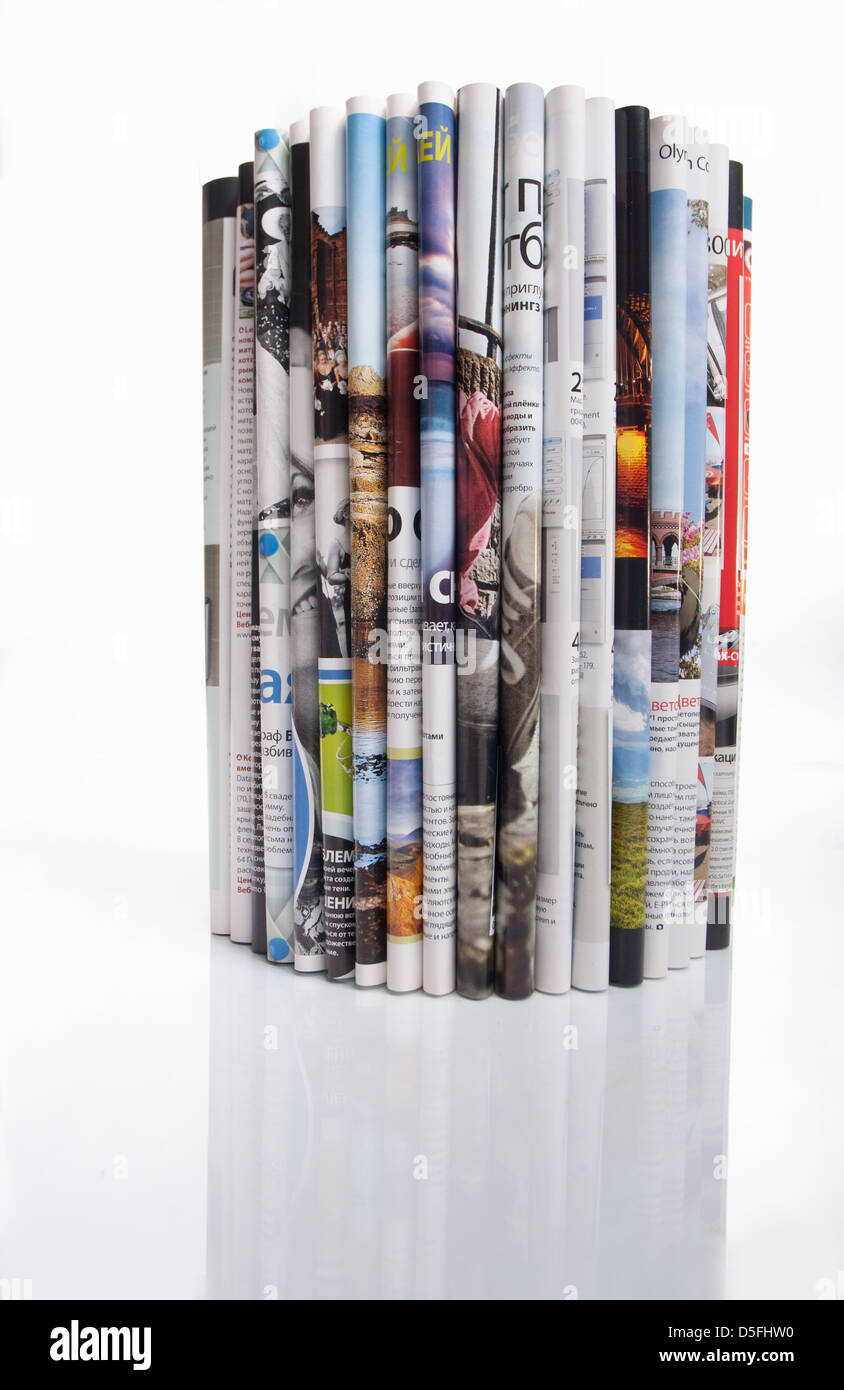 Open magazine with curled pages. Close-up Stock Photo - Alamy