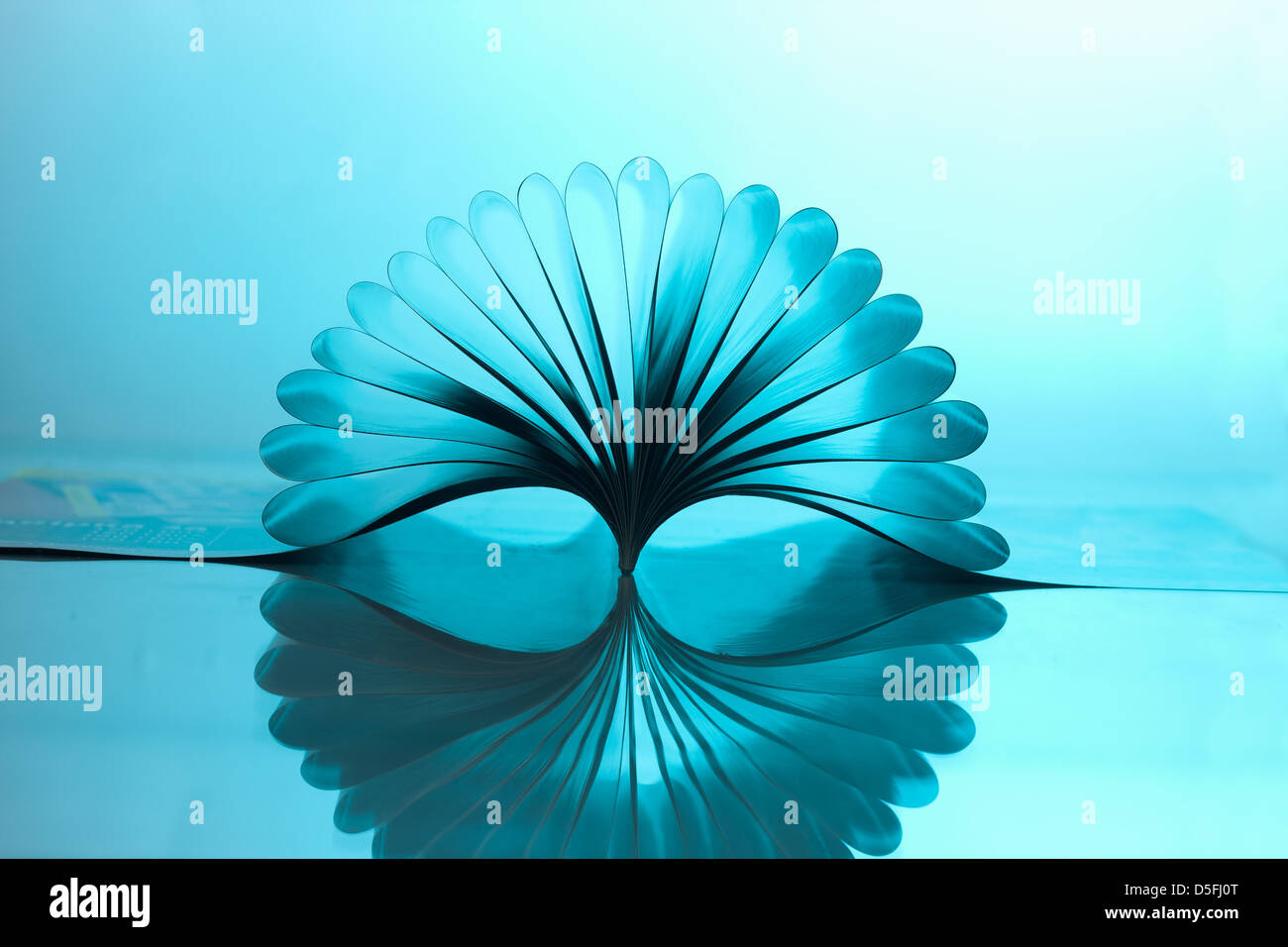 Open magazine with curled pages. Close-up Stock Photo - Alamy