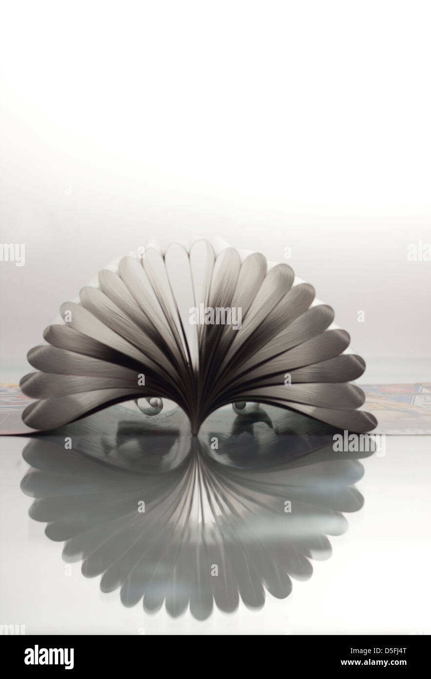 Open magazine with curled pages. Close-up Stock Photo - Alamy