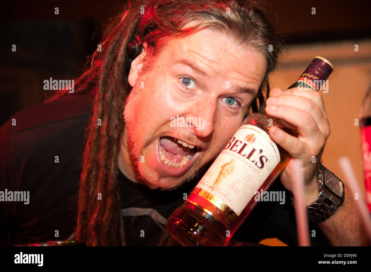 DJ and bottle of alcohol. DJ Scot Project concert open air GoodMood in ...