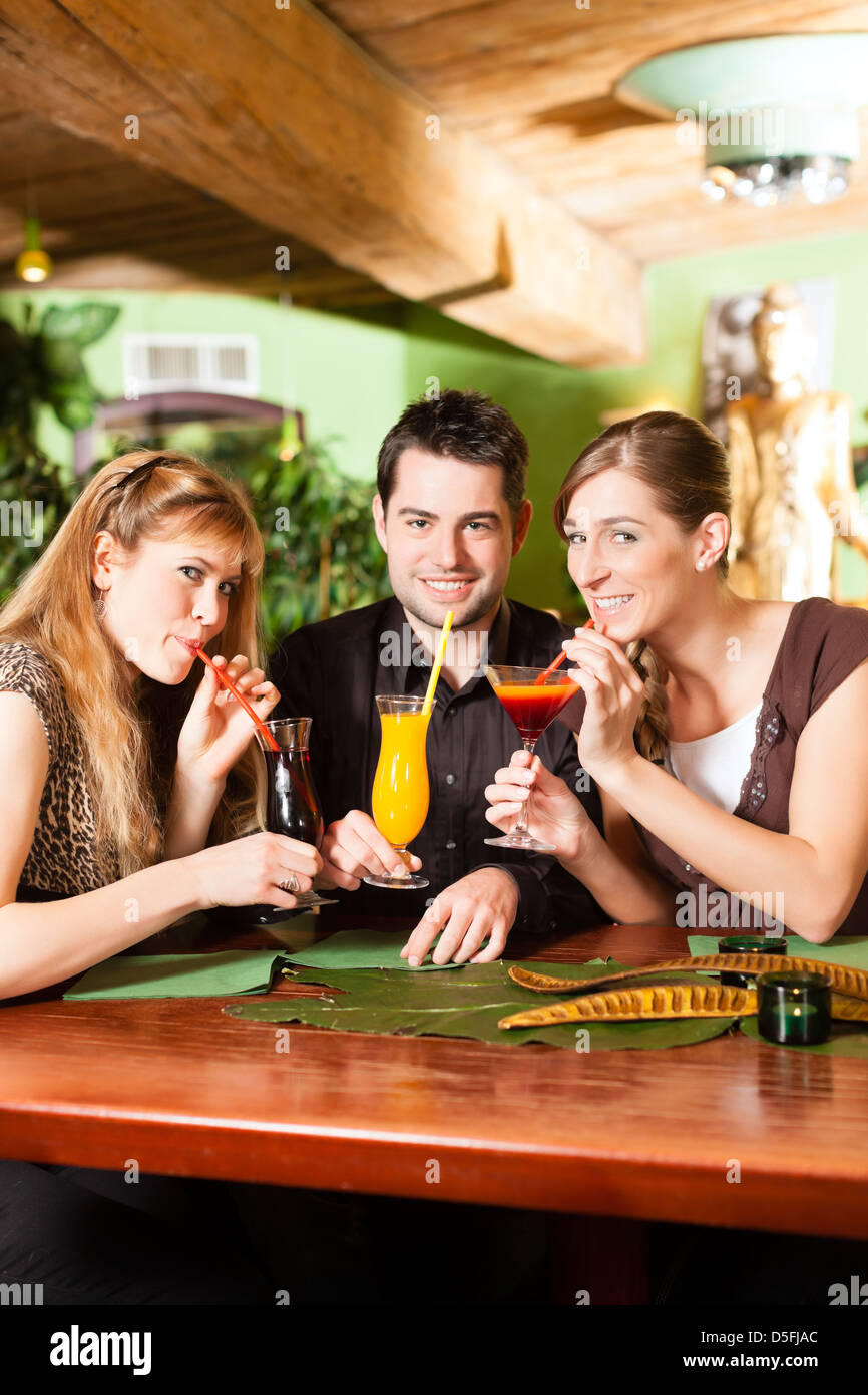Three glasses with a cocktail in bar hi-res stock photography and ...