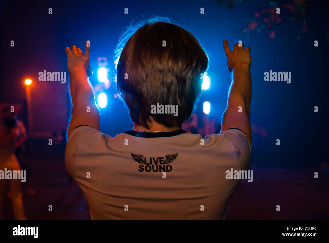 The man at the party, raising a hands to the top. DJ Scot Project ...