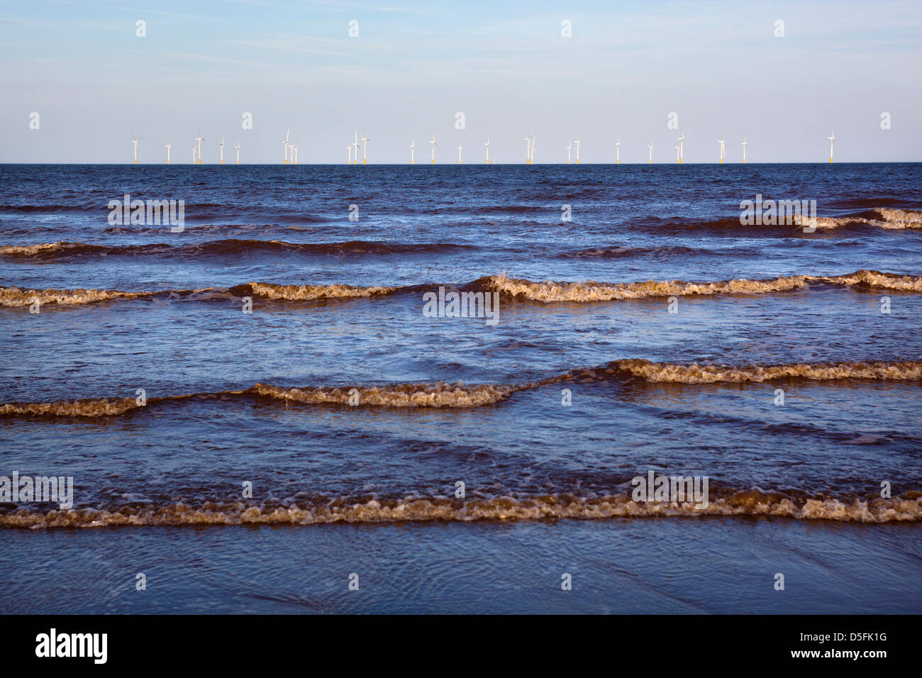 Waves at Skegness with Windfarm in background Stock Photo - Alamy
