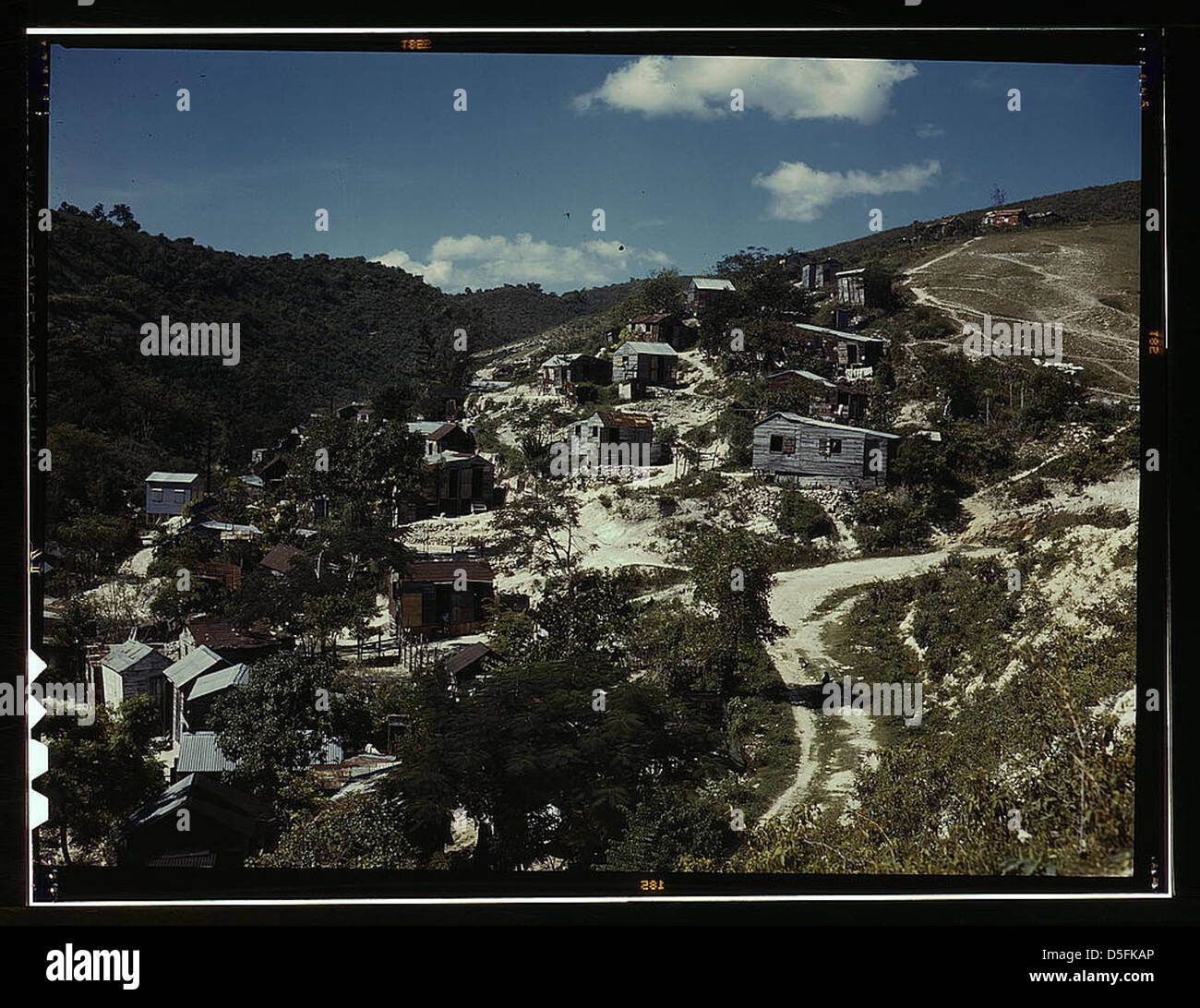 This image presents a rural mountain town in Puerto Rico, showcasing ...