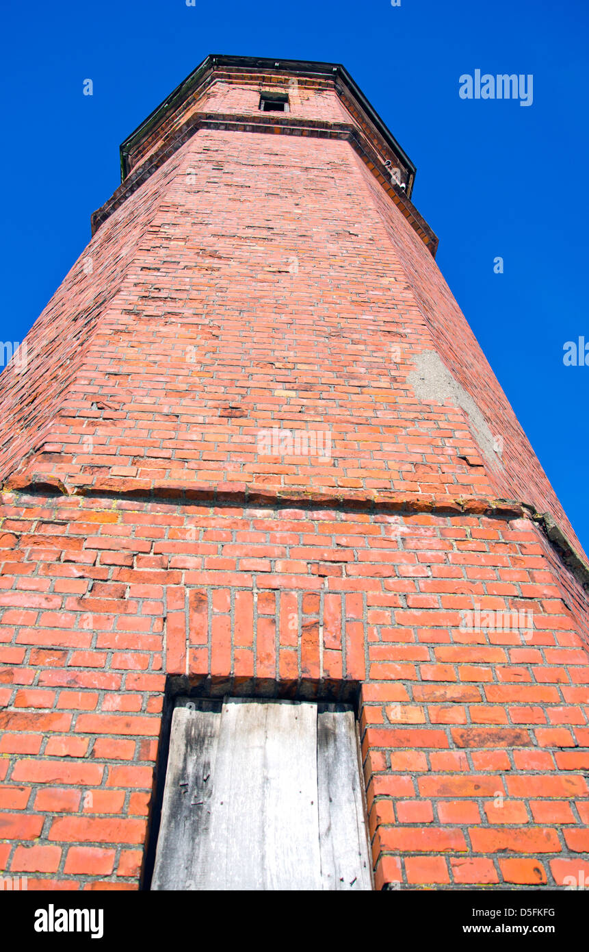 historical red bricks tower in old derelict train station Stock Photo ...