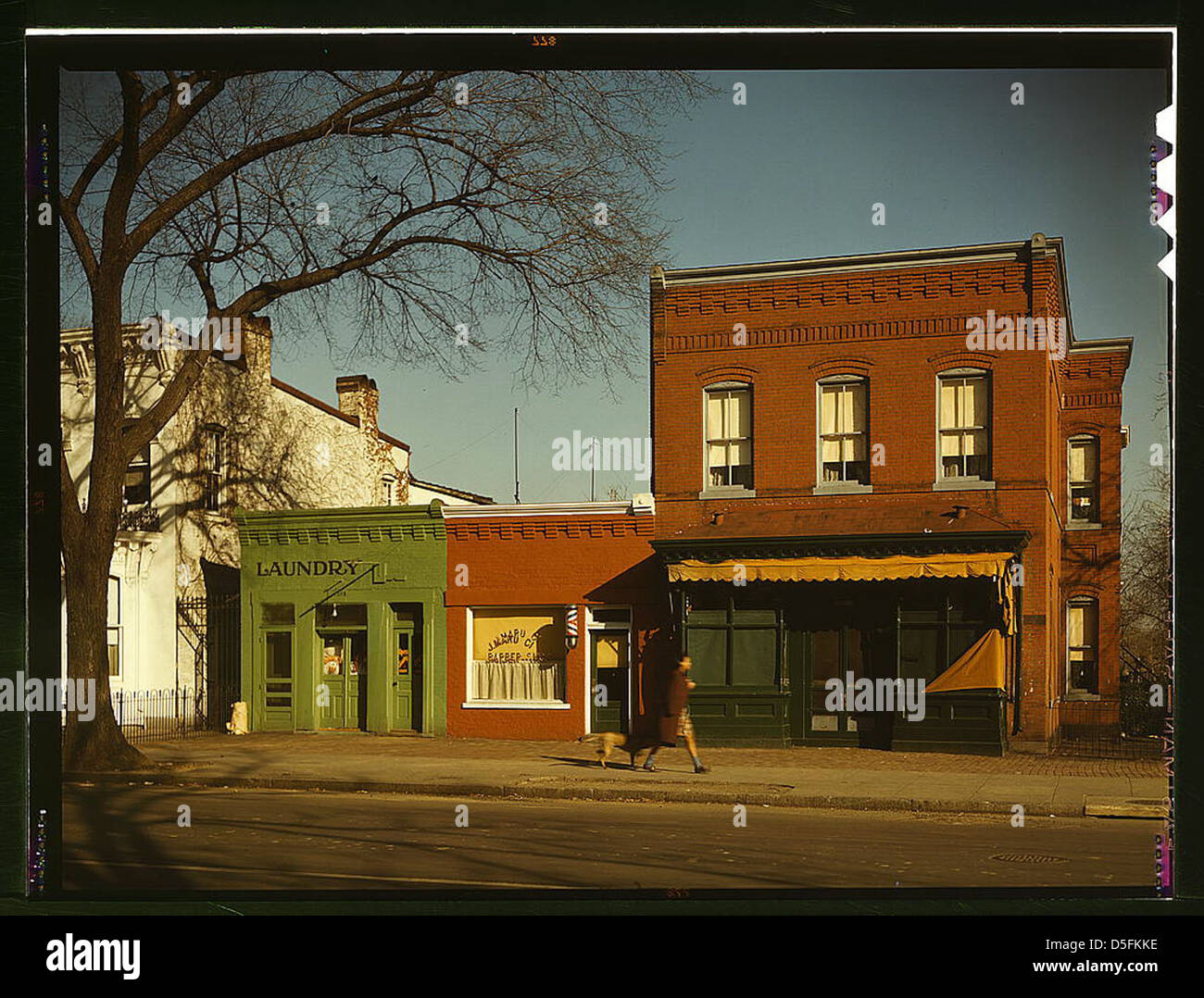 A historical photograph from the 1940s, showing a street scene in ...