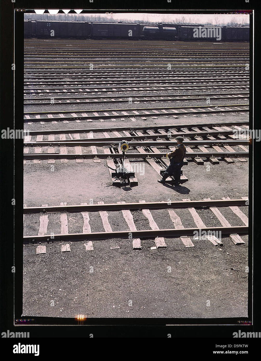 A switchman operates a track switch at the Proviso yard of the Chicago ...