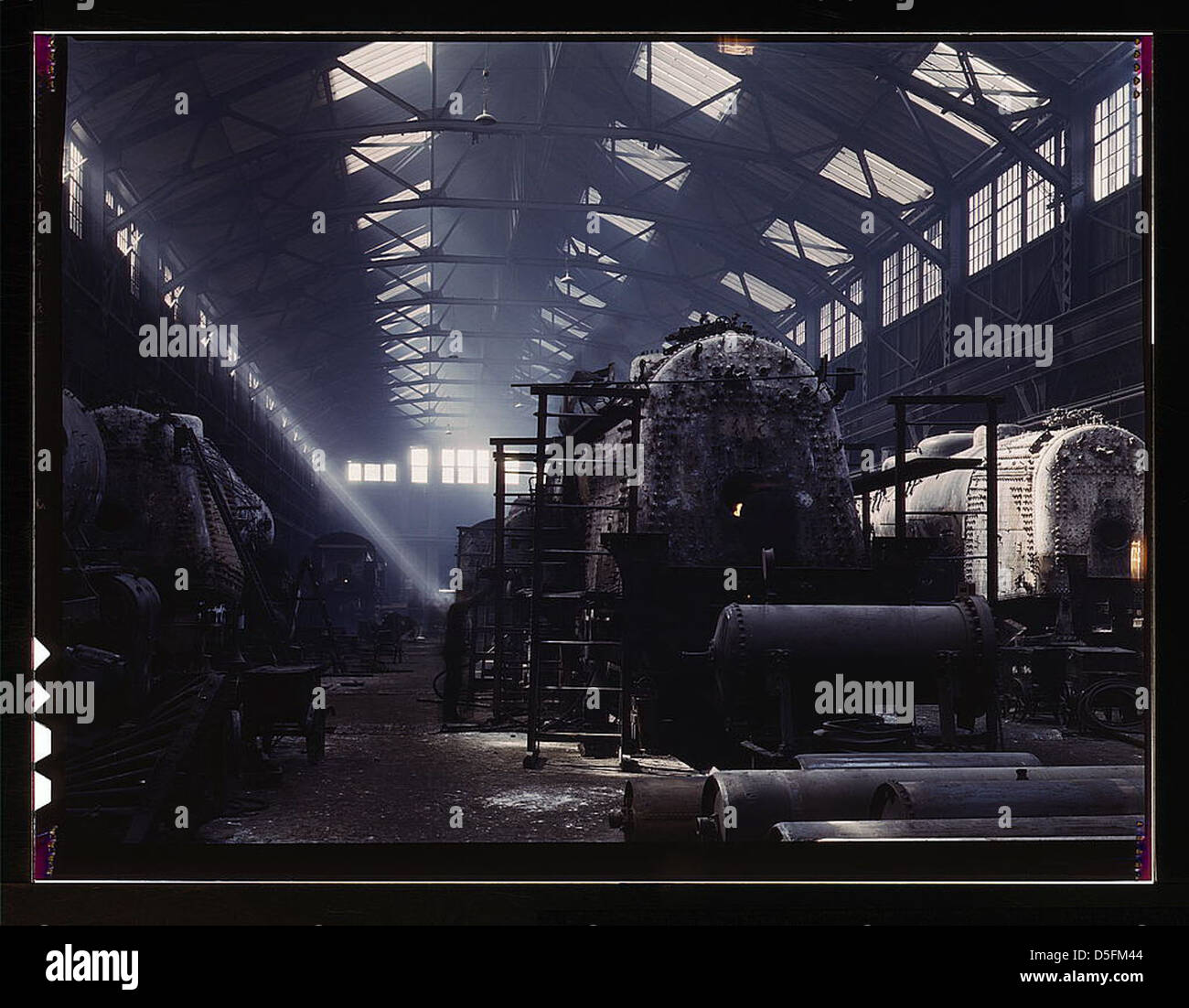 This image from 1943 depicts the Santa Fe Railroad locomotive shops in ...