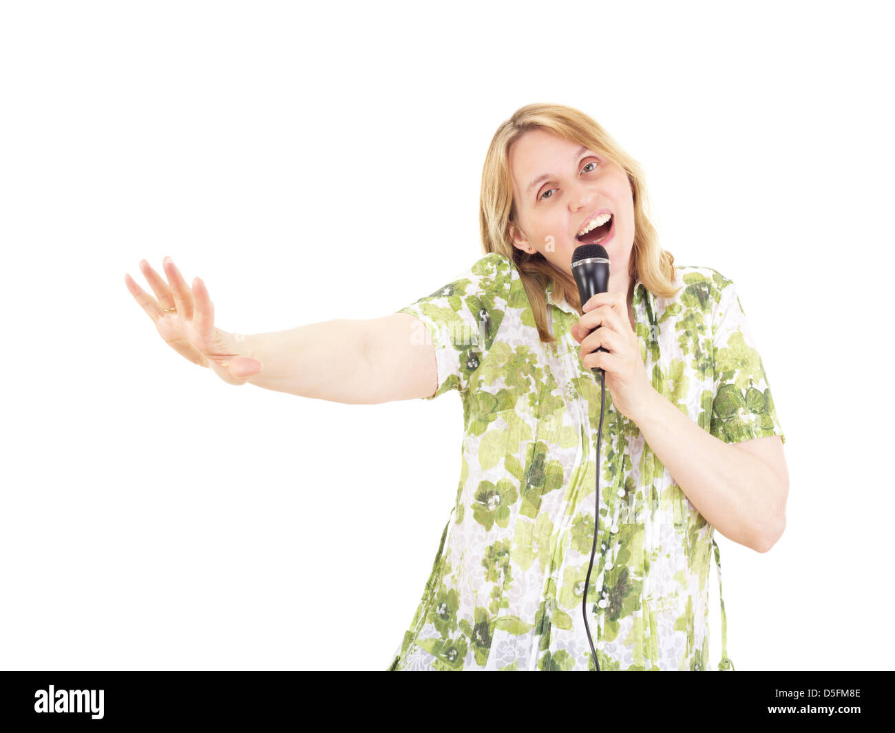 Beautiful woman singing and dancing Stock Photo - Alamy