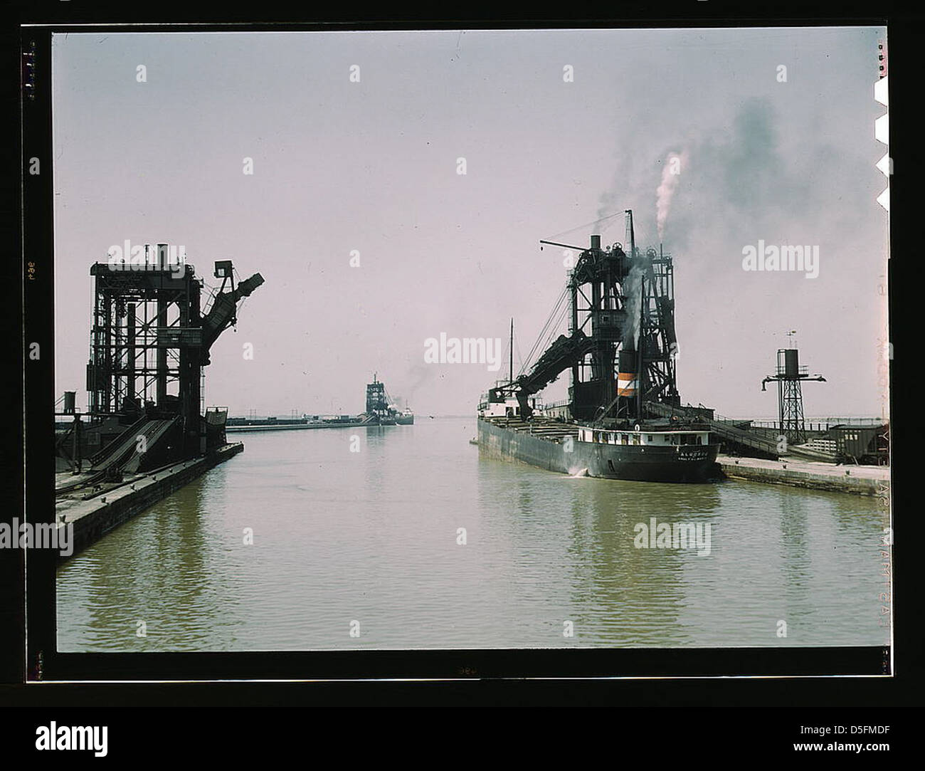 A 1943 photograph showing ore being unloaded from the lake steamer ...